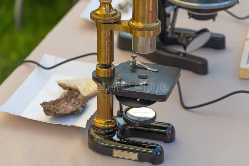 Vintage Brass Microscope on Display with Geological Samples Stock Image ...