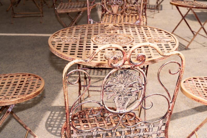 Vintage Brown Rusty Metal Table and Chair Outside Stock Image - Image ...