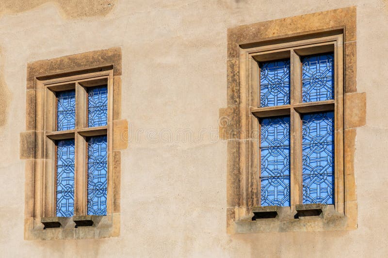 Vintage Building with Blue Stained Glass Windows in Stone Frames Stock ...