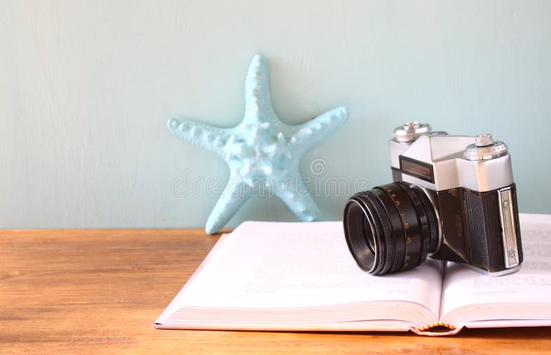 Vintage Camera, Book and Decorations Over Wooden Shelf Stock Photo ...