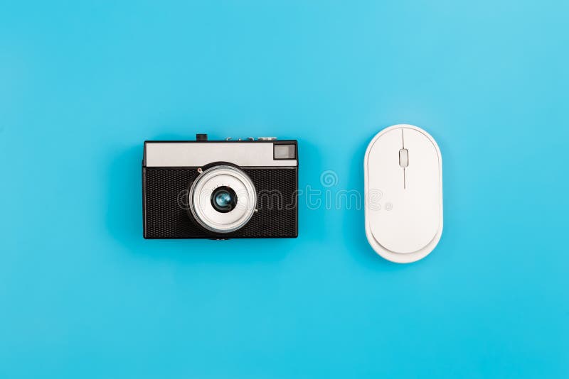 Vintage Camera and Computer Mouse on a Blue Background Isolated. Stock ...