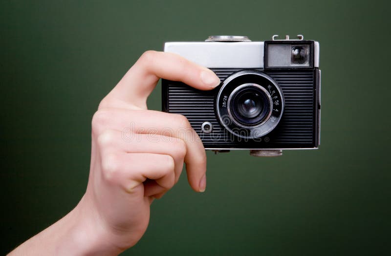 Vintage camera in hand stock image. Image of holding - 39478663
