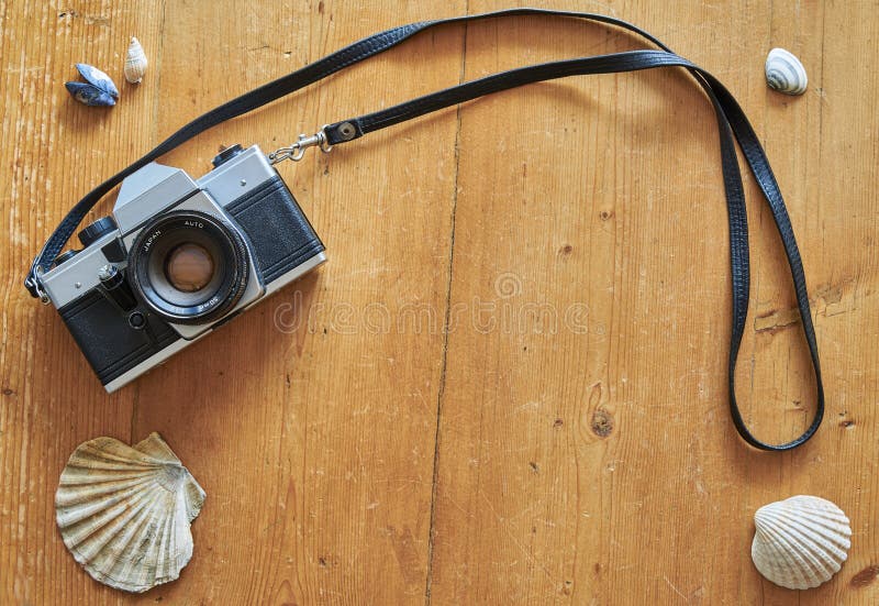 Vintage Camera and Seashells on a Wooden Table Stock Photo - Image of ...
