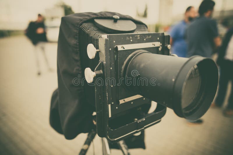 Vintage camera on a tripod stock photo. Image of huge - 157558576