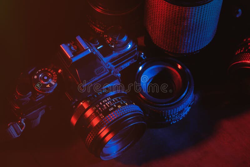 Vintage Cameras and Lenses Illuminated in Red and Blue Stock Photo ...