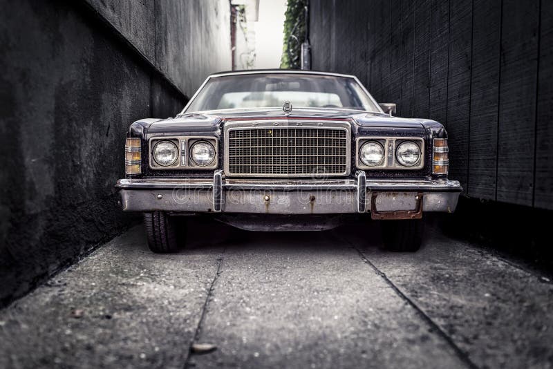Vintage car in alleyway stock photo. Image of sedan, headlights - 82958230