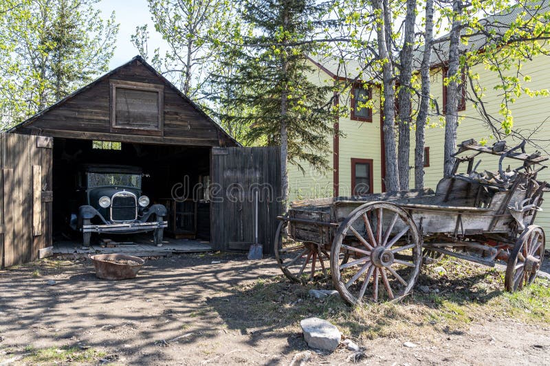 Vintage Car and Wooden Wagon in Rustic Barn Editorial Stock Photo ...