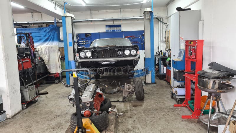 A Vintage Car is in a Workshop Being Restored Stock Photo - Image of ...