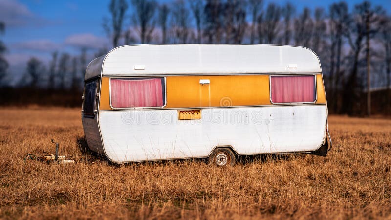 Vintage Caravan in an Open Field Under a Bright Blue Sky during the Day ...