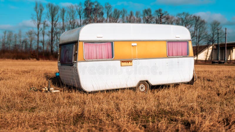 Vintage Caravan in an Open Field Under a Bright Blue Sky during the Day ...
