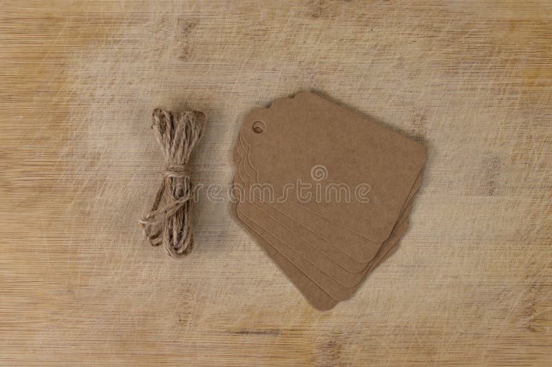 Vintage Cardboard Blank Tags Craft or Label on Wooden Surface Stock ...