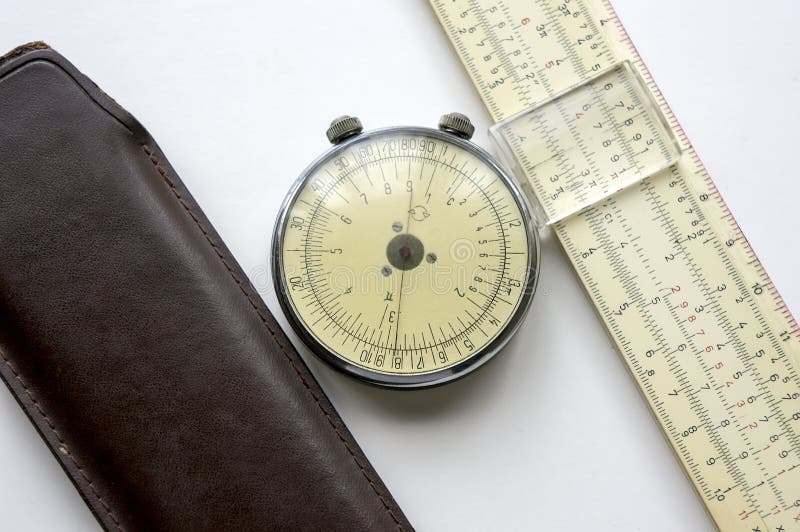 Vintage Circular and Flat Slide Rule with a Case on a White Background ...