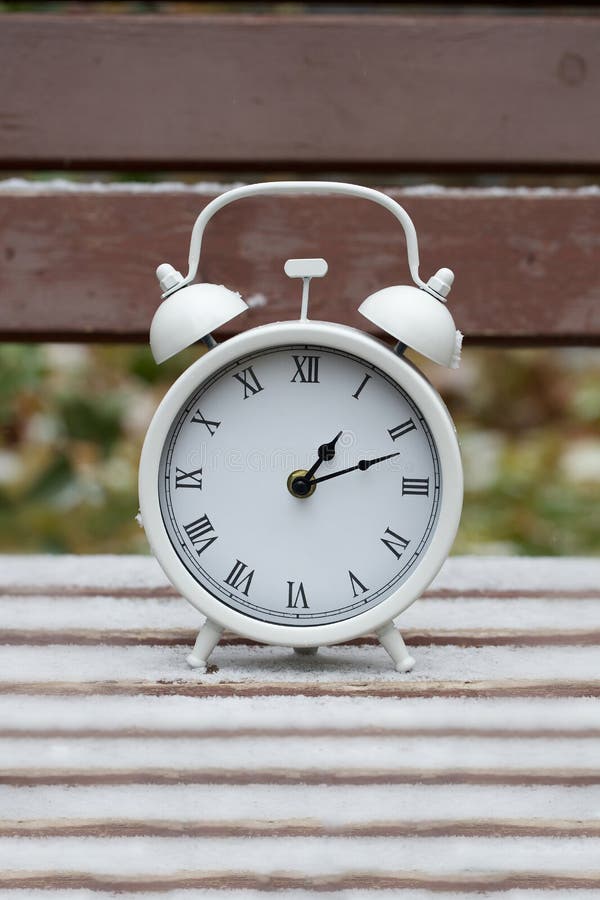 Vintage clock on a bench stock image. Image of cool - 102644209
