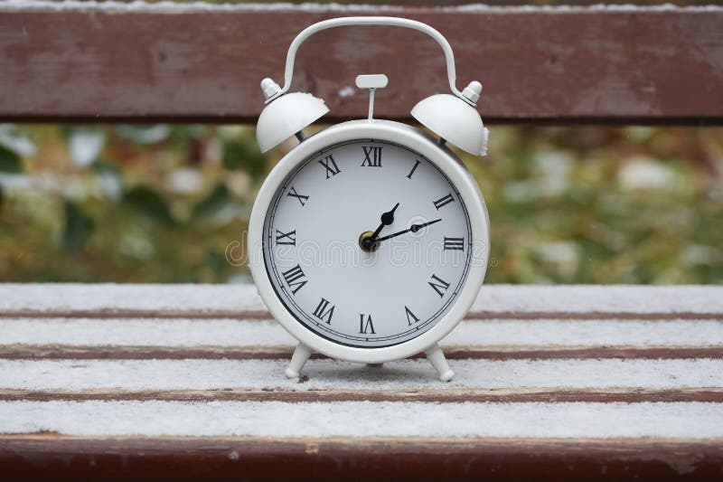 Vintage clock on a bench stock photo. Image of forward - 102644126