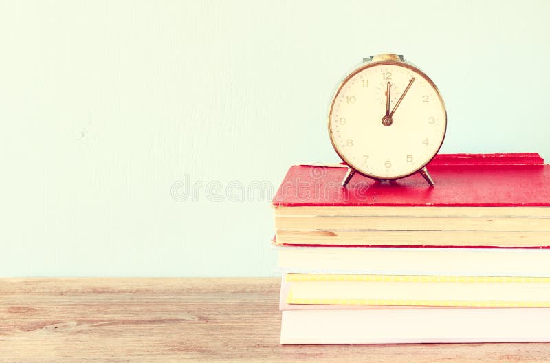 Vintage clock on books stock photo. Image of book, grunge - 38124710