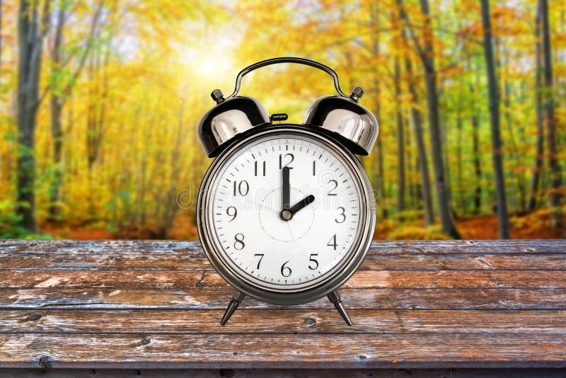 Vintage Clock in a Forest in Autumn Fall Daylight Savings Time Change ...