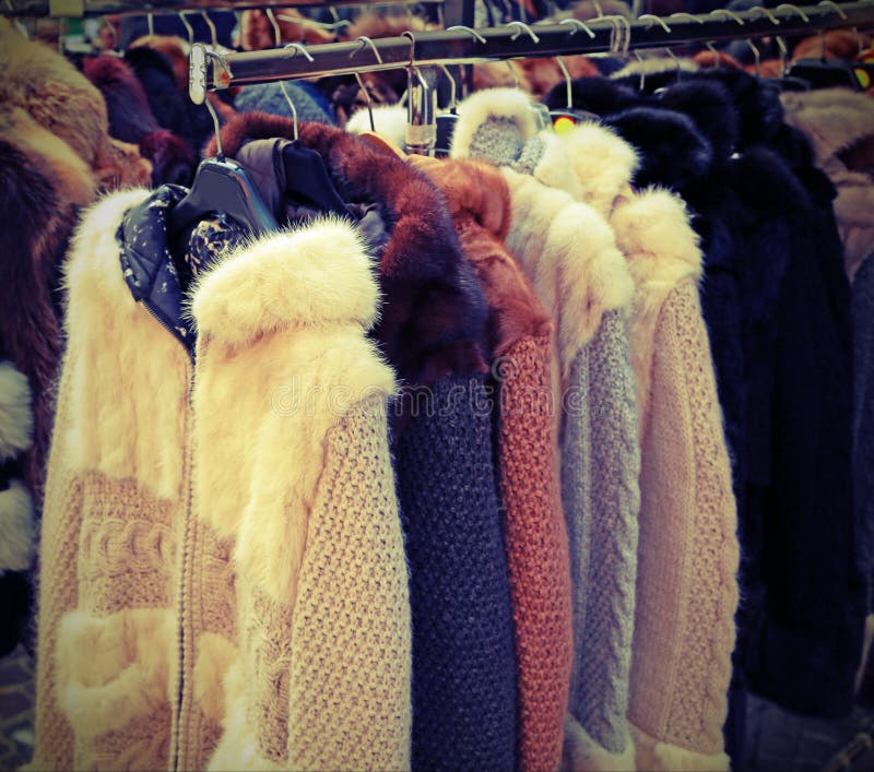 Clothes and Fur at Flea Market with Vintage Effect Stock Image - Image ...
