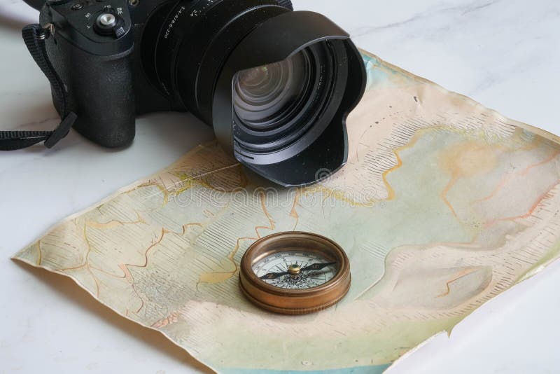 Vintage Compass on a Hand Made Map with Camera for Exploring Stock ...