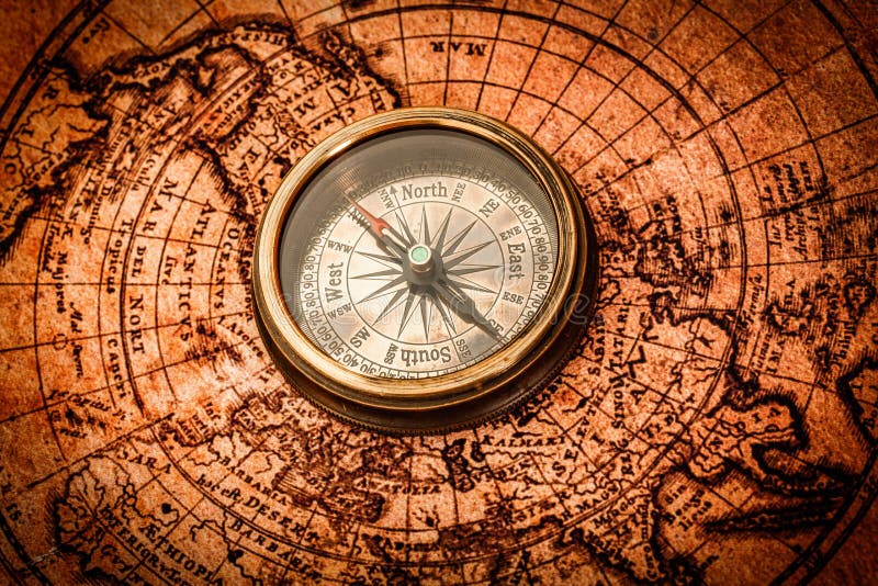 Vintage Compass Lies on an Ancient World Map. Stock Photo - Image of ...