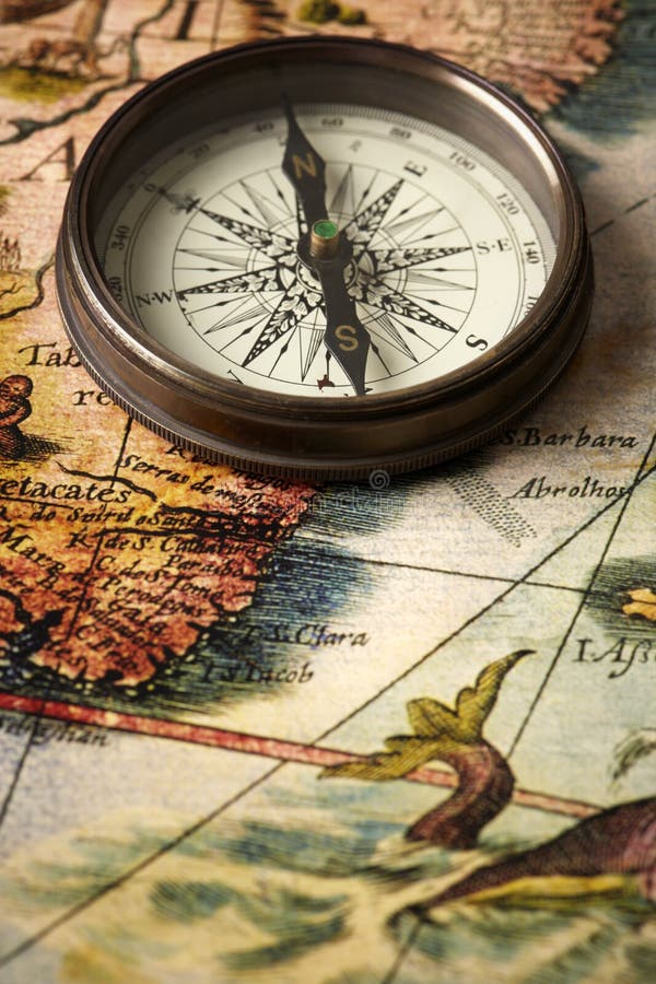 Vintage compass on a map stock photo. Image of object - 12956620