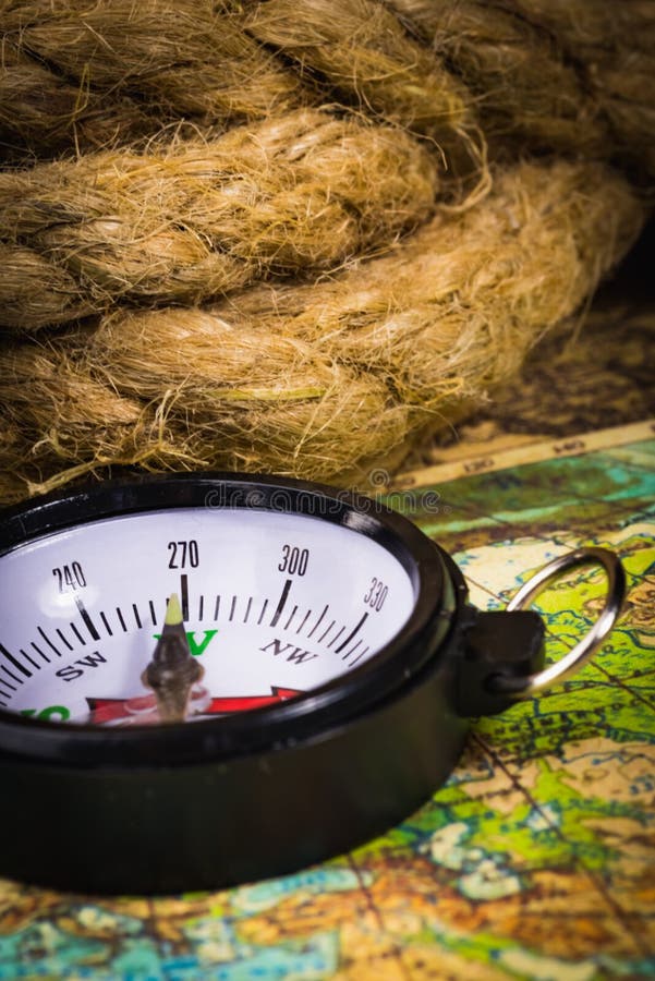 Vintage compass with rope stock photo. Image of direction - 95460422