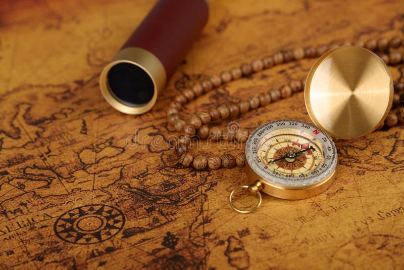 Vintage Compass and Spyglass on Old Map - Trade and Explorer Concept ...