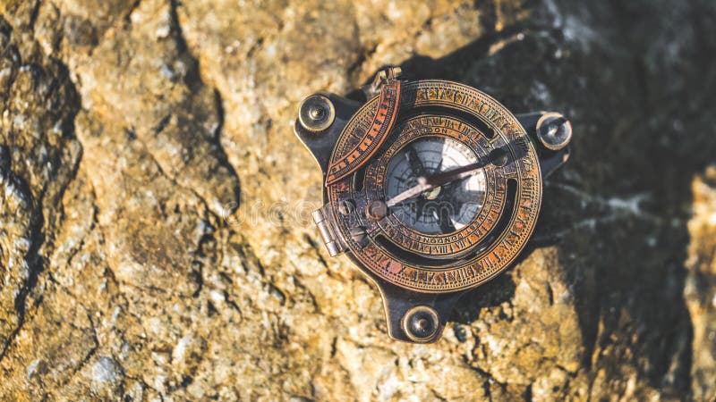 Vintage Compass on Stone Rock Stock Photo - Image of paleontology ...