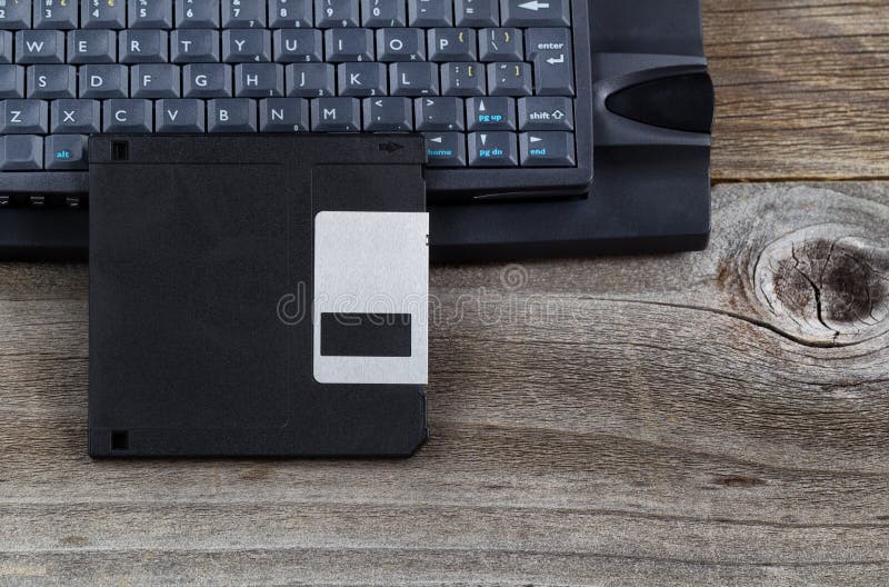 Vintage Computer Storage Disk on Aged Wood Stock Photo - Image of ...