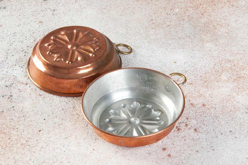 Vintage Copper Molds on a Concrete Background. Stock Photo - Image of ...