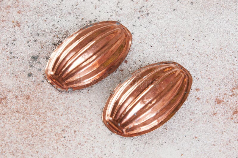 Vintage Copper Molds on a Concrete Background. Stock Photo - Image of ...
