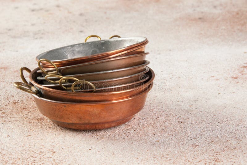 Vintage Copper Molds on a Concrete Background. Stock Photo - Image of ...