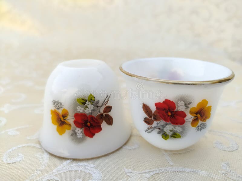 Vintage Cups with Floral Textures are Uniquely Arranged on the Table ...
