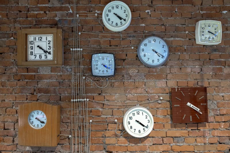 Vintage Diverse Clock with Wires on a Red Brick Wall. Rough Surface ...