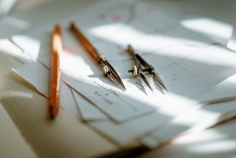 Vintage Drawing Tools Laying on a Stack of Paper Stock Image - Image of ...
