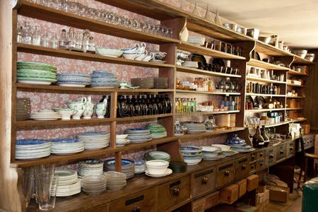 Vintage Dry Goods Store with Glassware on Display Stock Photo - Image ...
