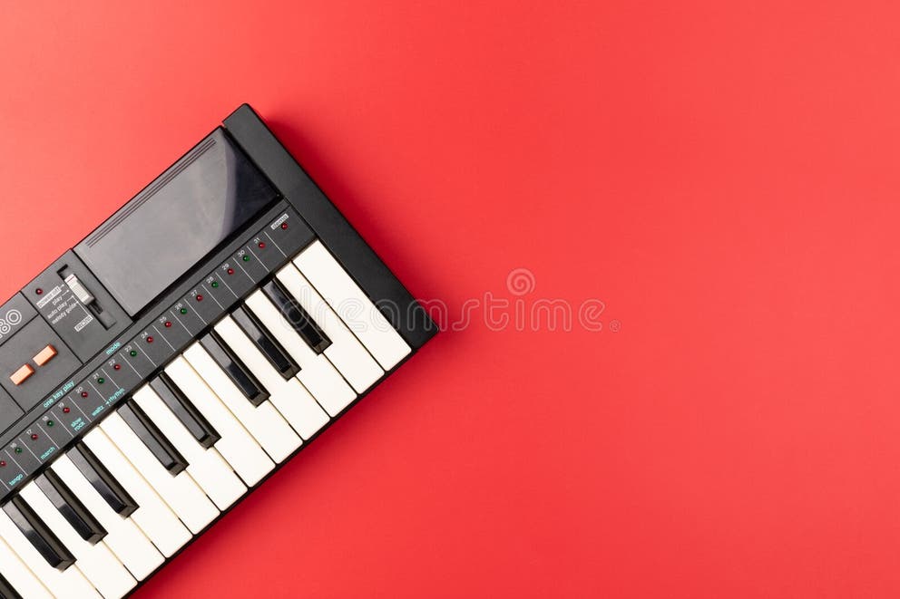 Vintage Electronic Keyboard Synth Piano on Red Background Stock Photo ...