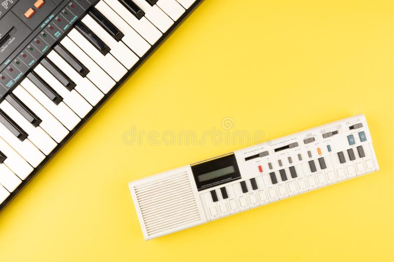 Vintage Electronic Keyboard Synth Piano on Yellow Background Stock ...