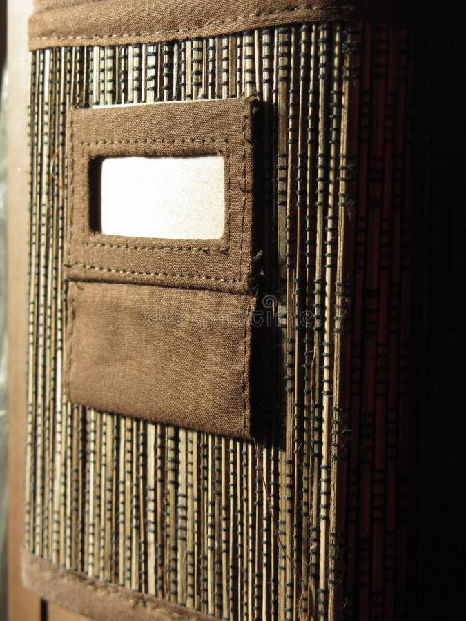 Vintage Folder with Blank Label Standing on Shelf Stock Photo - Image ...