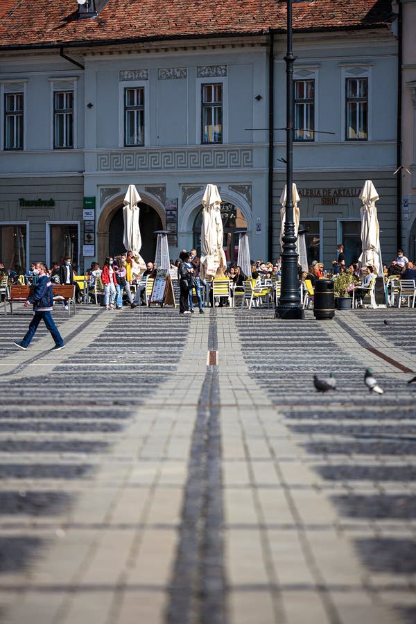 Coblestone Pathway and Old Building Facade with People Passing by ...
