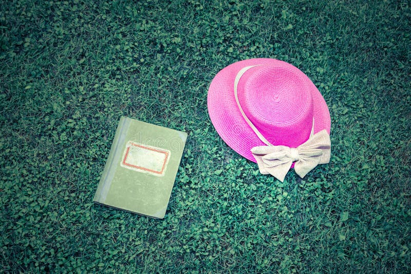 Vintage Hat and Old Book Lying on Park Grass Stock Image - Image of ...