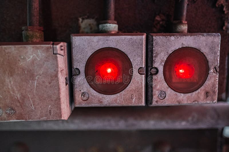 Vintage Industrial Control Panel with Red Warning Lights in a Factory ...
