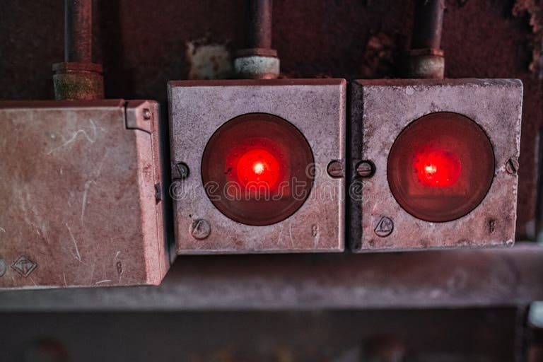 Vintage Industrial Control Panel with Red Warning Lights in a Factory ...