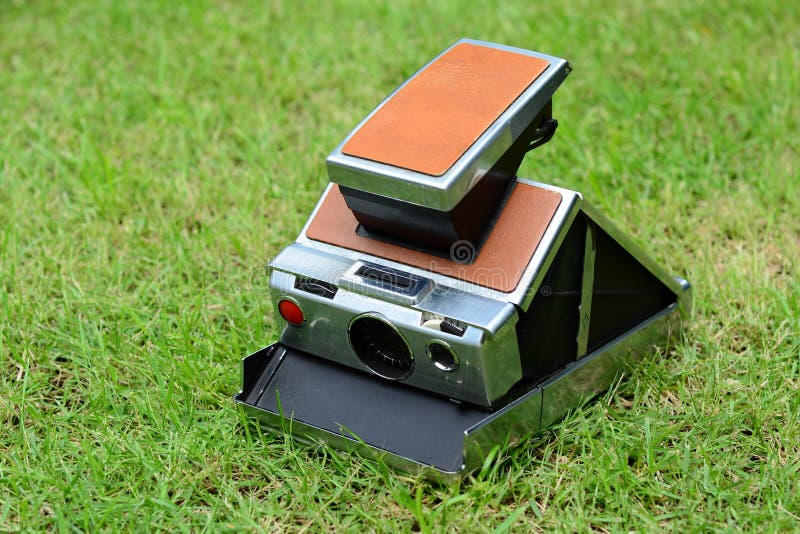 Vintage Instant Camera on Green Grass Stock Photo - Image of camera ...