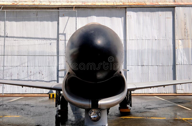 Vintage Jet Fighter Aircraft in Front of Hangar Stock Photo - Image of ...