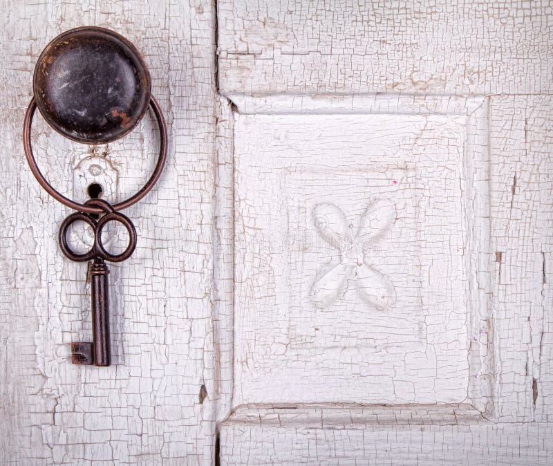 Vintage Key Hanging on a Vintage Door Stock Photo - Image of cracked ...