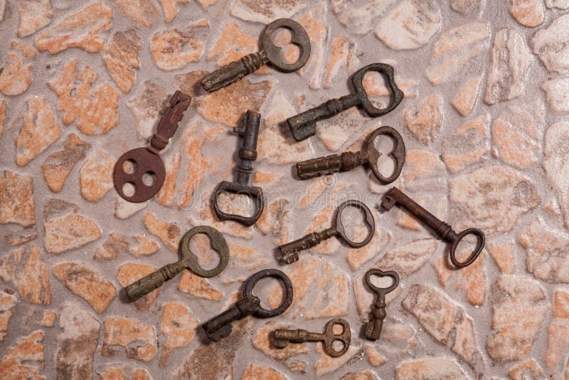 Vintage Keys on the Stone Floor Stock Photo - Image of brown, clue ...
