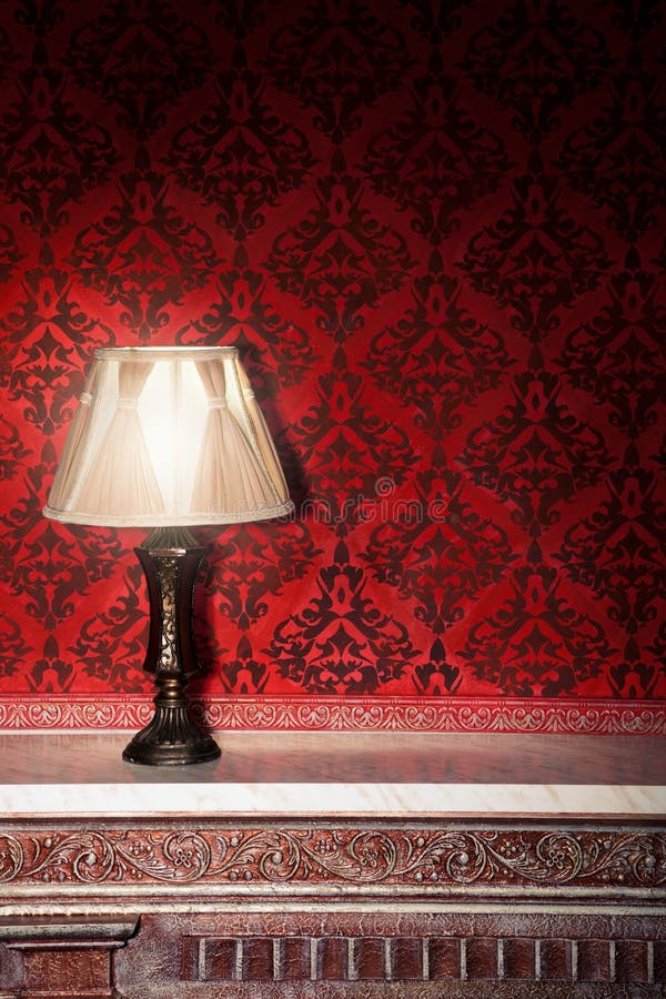 Vintage Lamp on Old Fireplace in Room with Red Rocco Pattern Stock ...