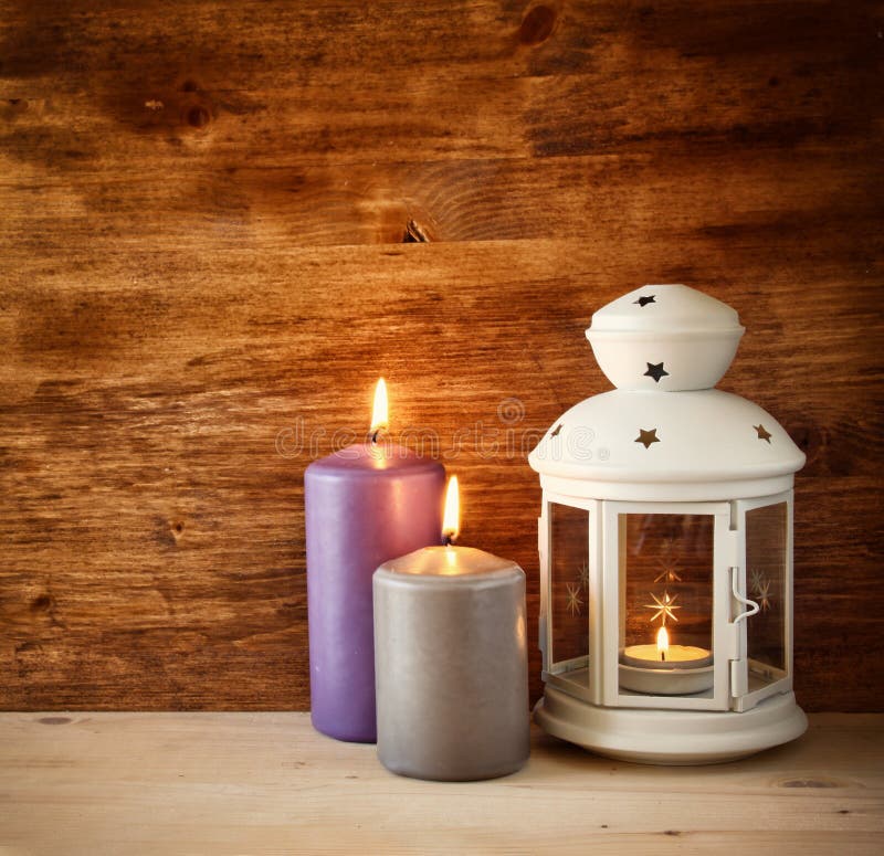 Vintage Lantern with Burning Candle on Wooden Table. Filtered Image ...