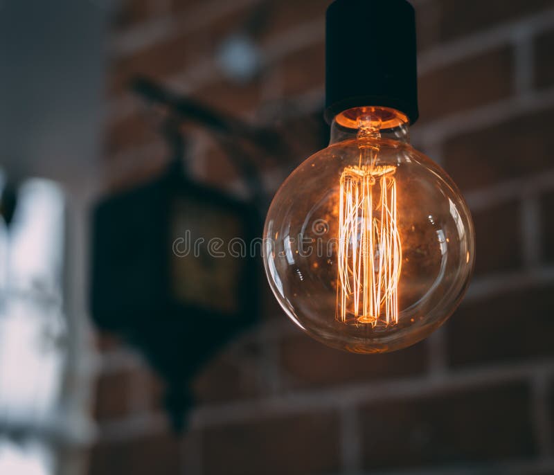 Vintage light bulb in cafe stock photo. Image of light - 111370362