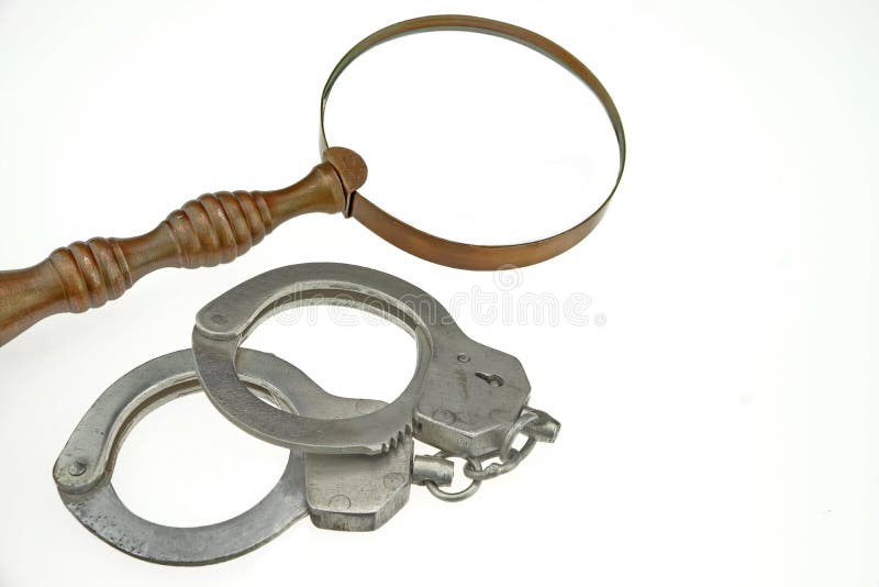 Vintage Magnifying Glass and Handcuffs Isolated Stock Image - Image of ...